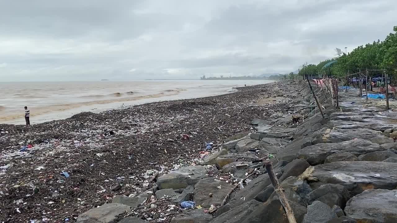 Indonesian beach overwhelmed with litter washing up on shore