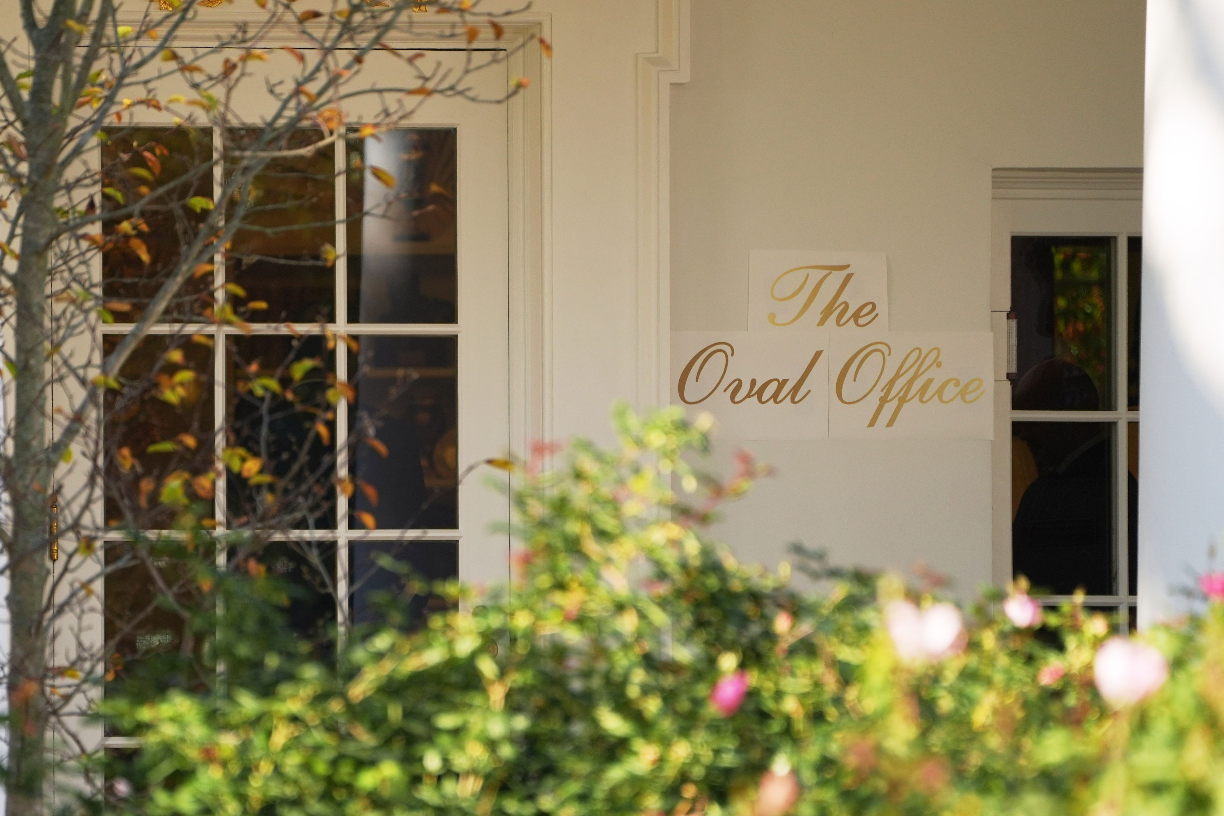 What’s going on with Trump’s gold ‘Oval Office’ sign?