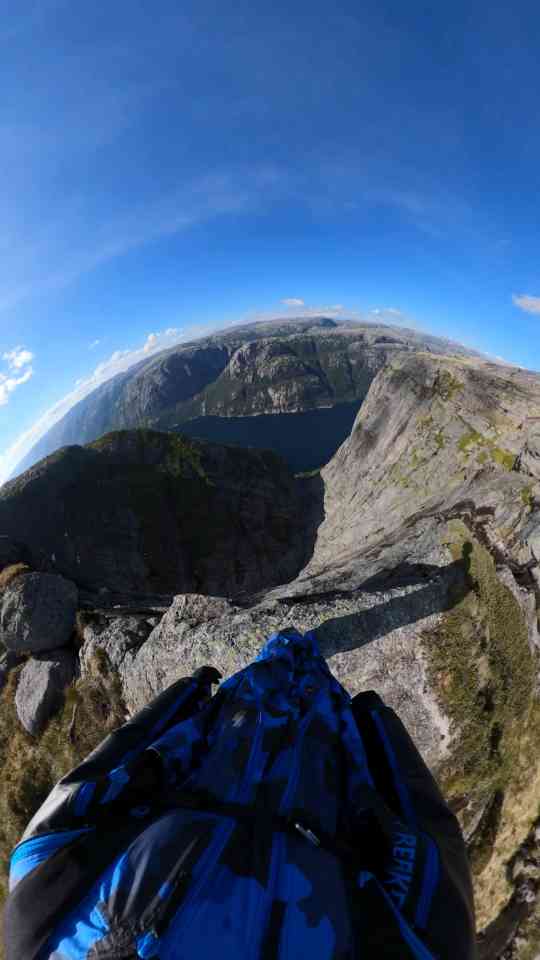 Man shows how extreme a squirrel suit BASE jump in Norway can get