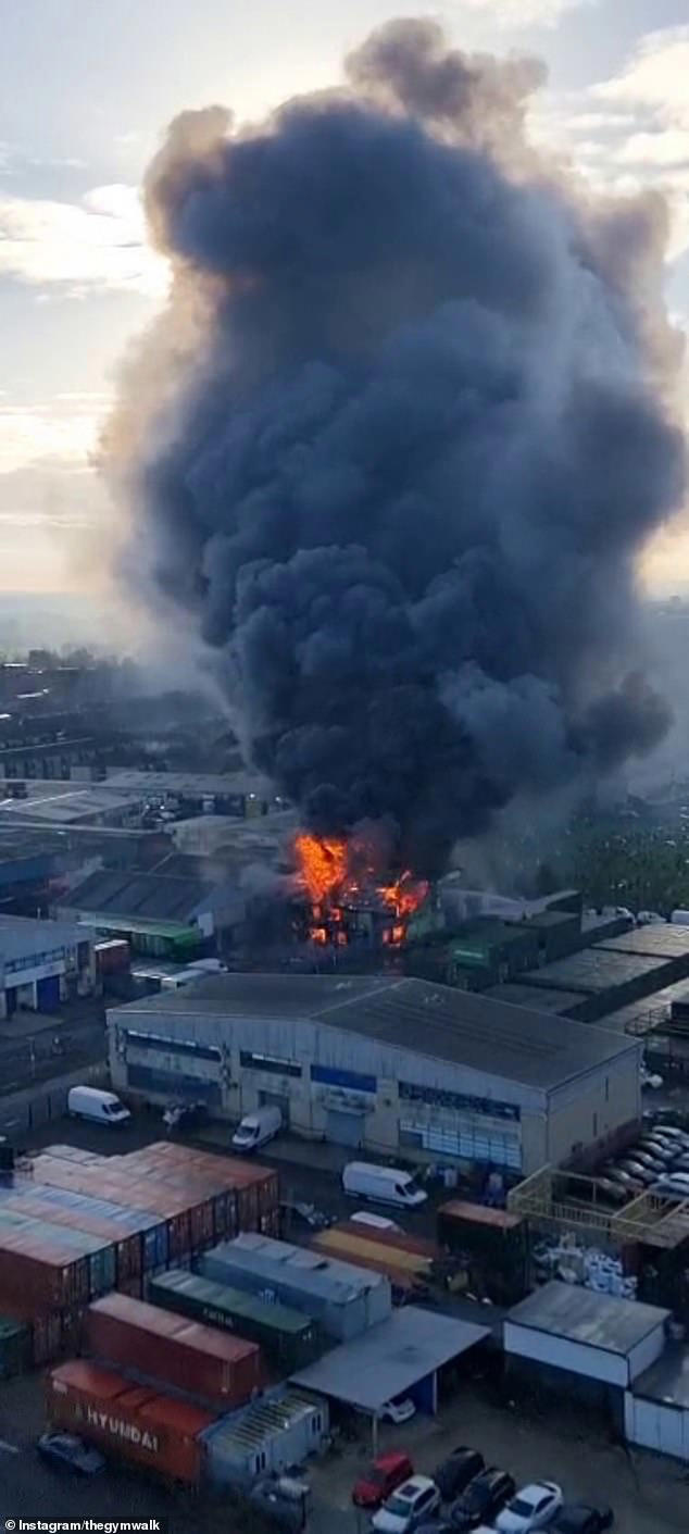Huge fire tears through warehouse as 150 firefighters rush to fight blaze