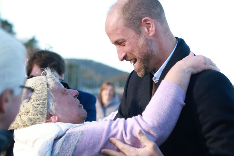 Prince William gets a big hug as crowds welcome him to Welsh beach