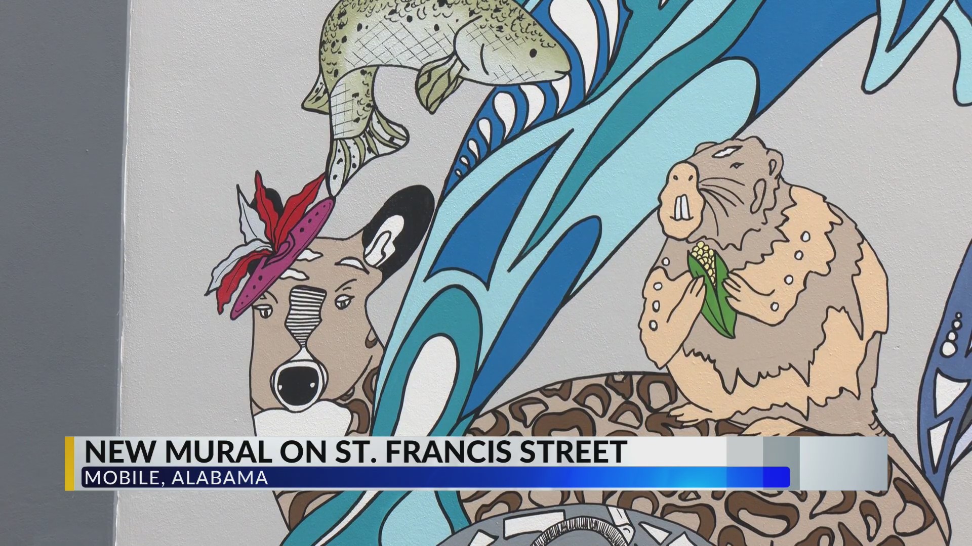 International artist unveils mural in downtown Mobile