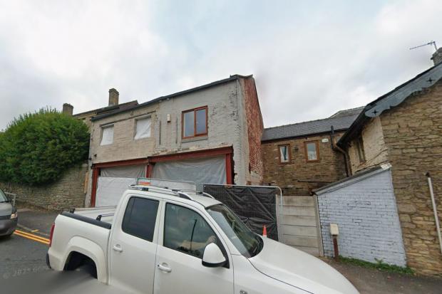 Plans to convert storage unit into four-bed HMO and two shops ruled on