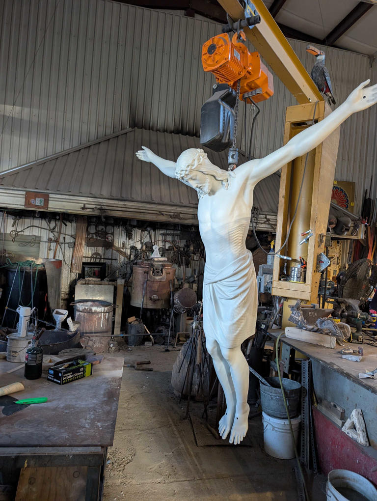 Historic crucifix repaired, back in place outside Maine Cathedral