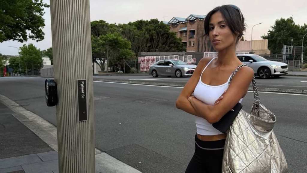 Bianca Censori's sister styles ultra tiny shorts with cami top in photos