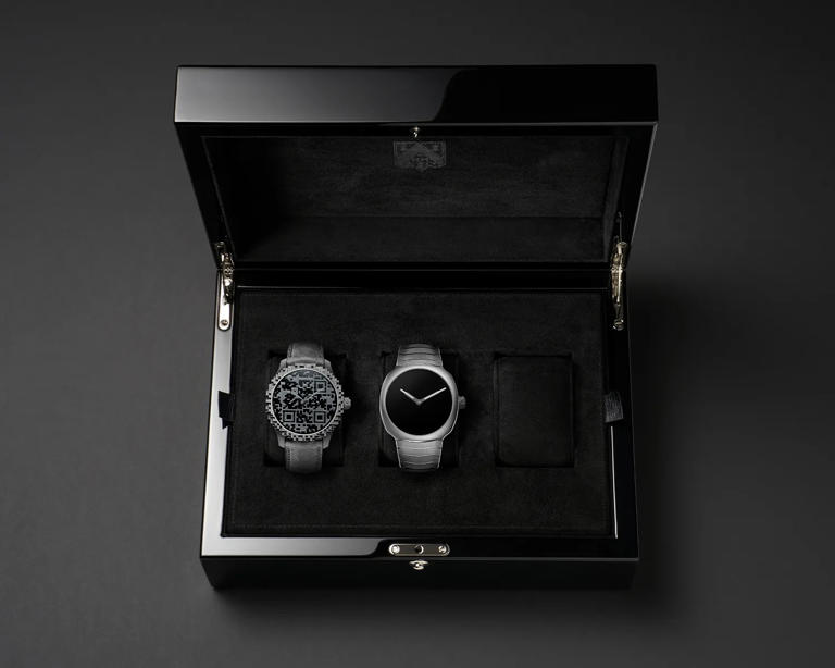 This mesmerizing steel sports watch has a dial made of the darkest ...