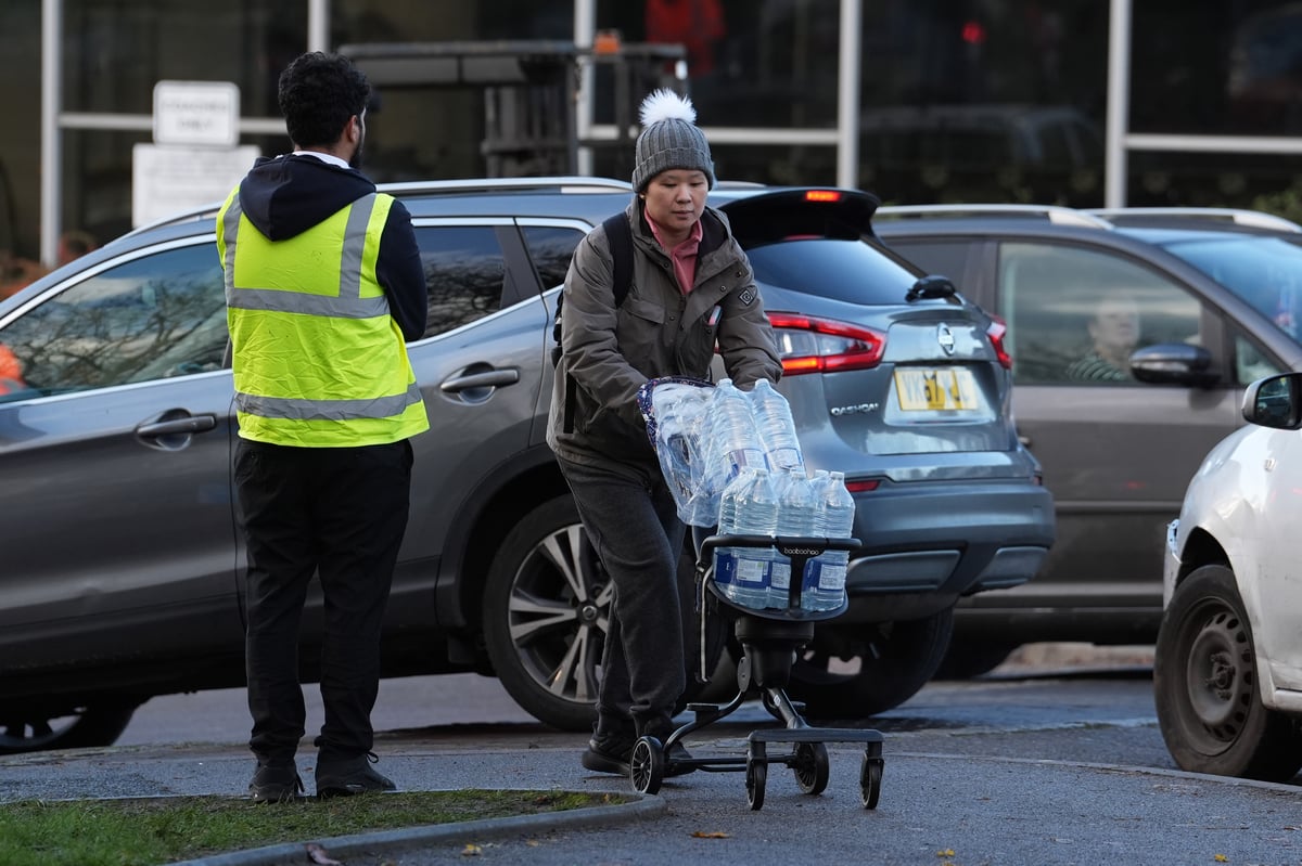 Parents queue for water for children in historic London commuter town