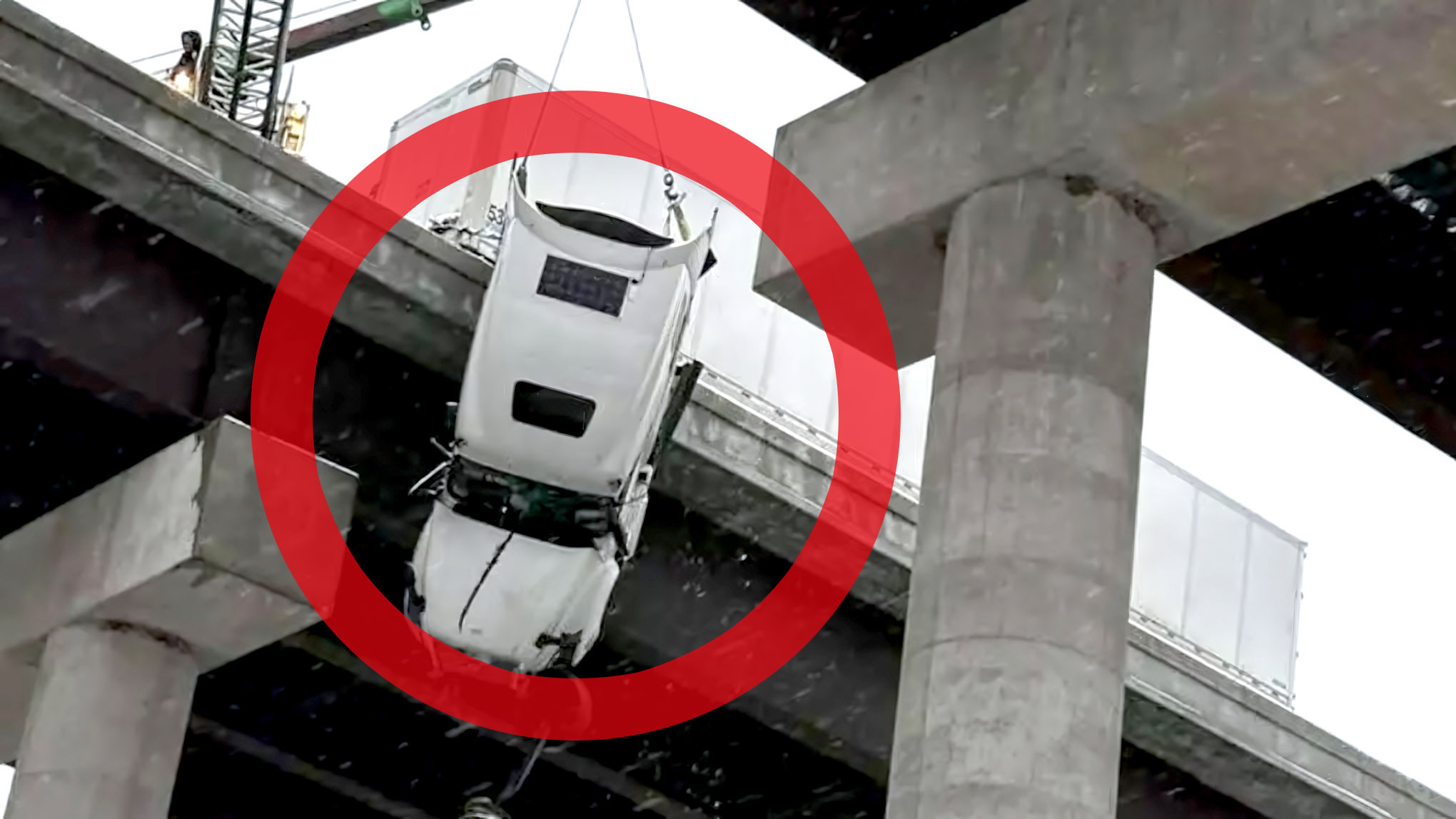 Semi driver spent hours dangling over bridge before daring save