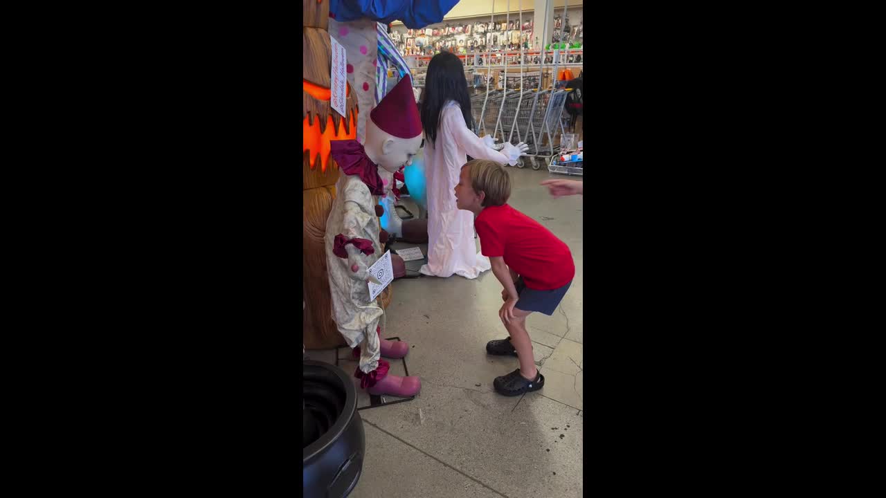 Boy startled by moving clown display in Los Angeles, USA