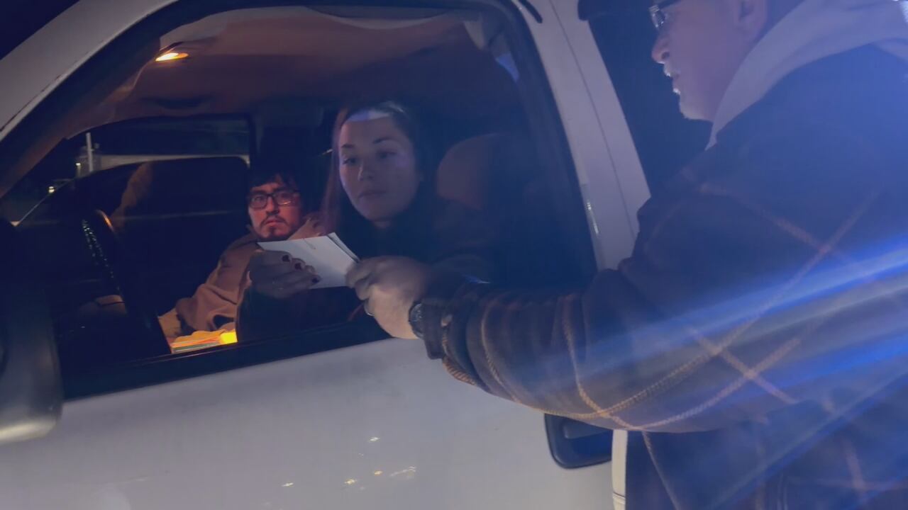 Drivers surprised with $100 bills instead of tickets during holiday event