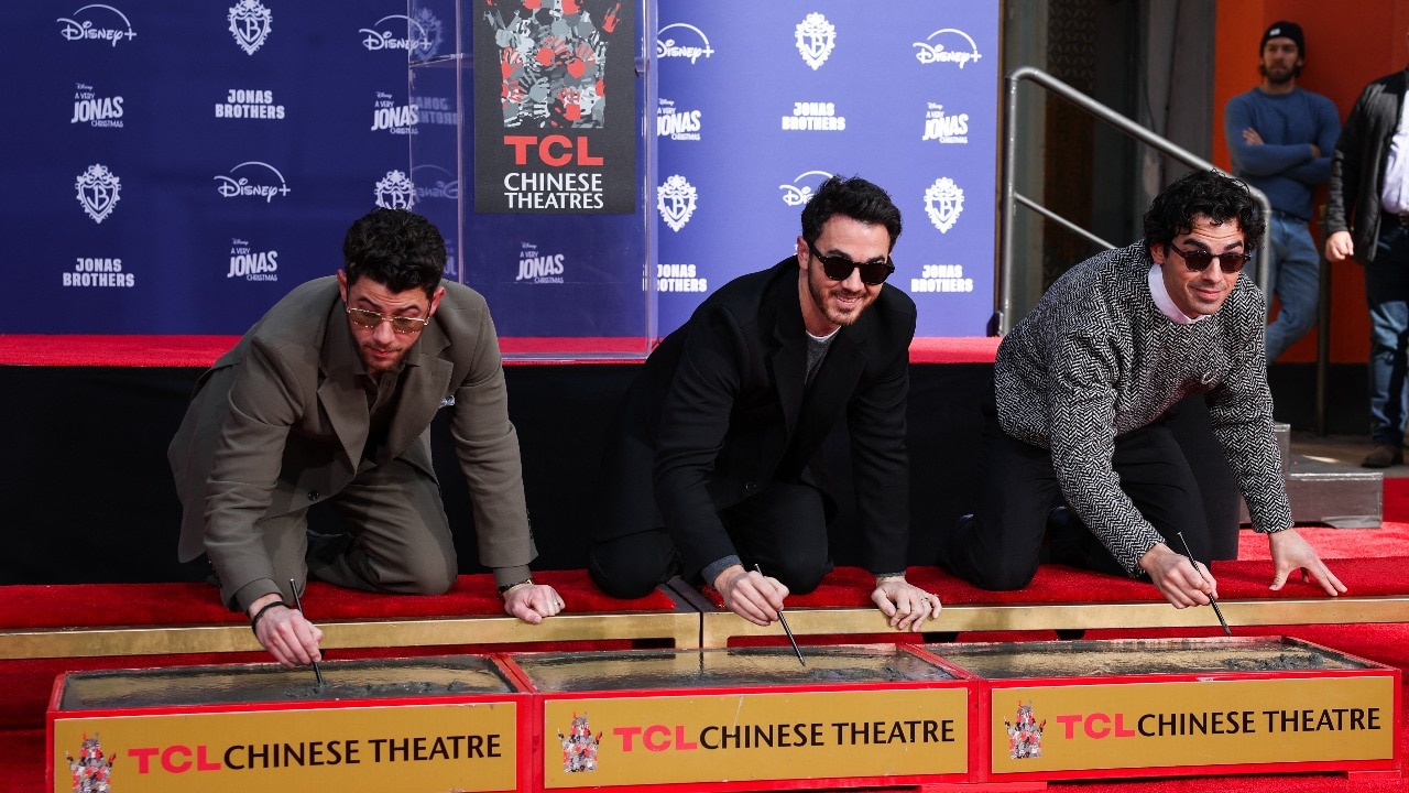 Jonas Brothers imprint hands, feet at TCL Theatre as they mark 20 years ...