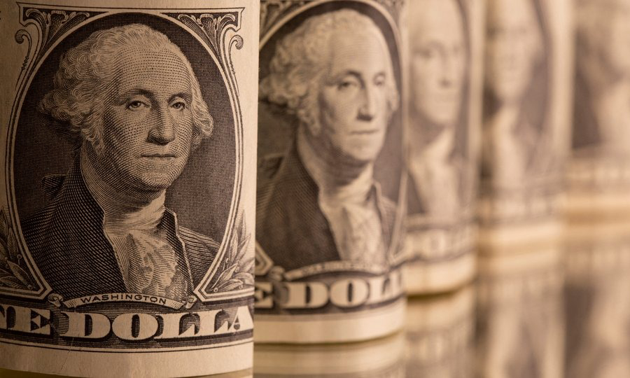 Dollar edges lower against dong