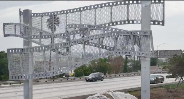 Filmstrip sculpture rises along the East Hollywood 101 Freeway