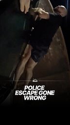 Moment handcuffed suspect leaps on police van to escape arrest