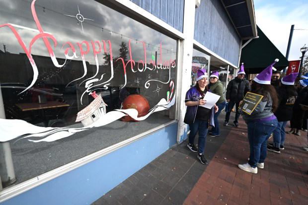 Holiday walk spotlights union, county tensions