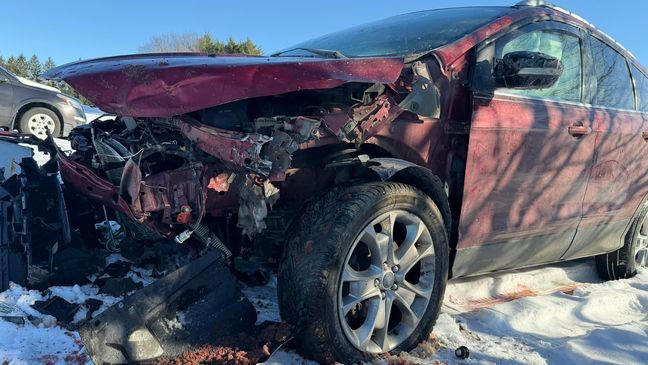 Person injured after driving up bed of tow truck, flipping car in ...