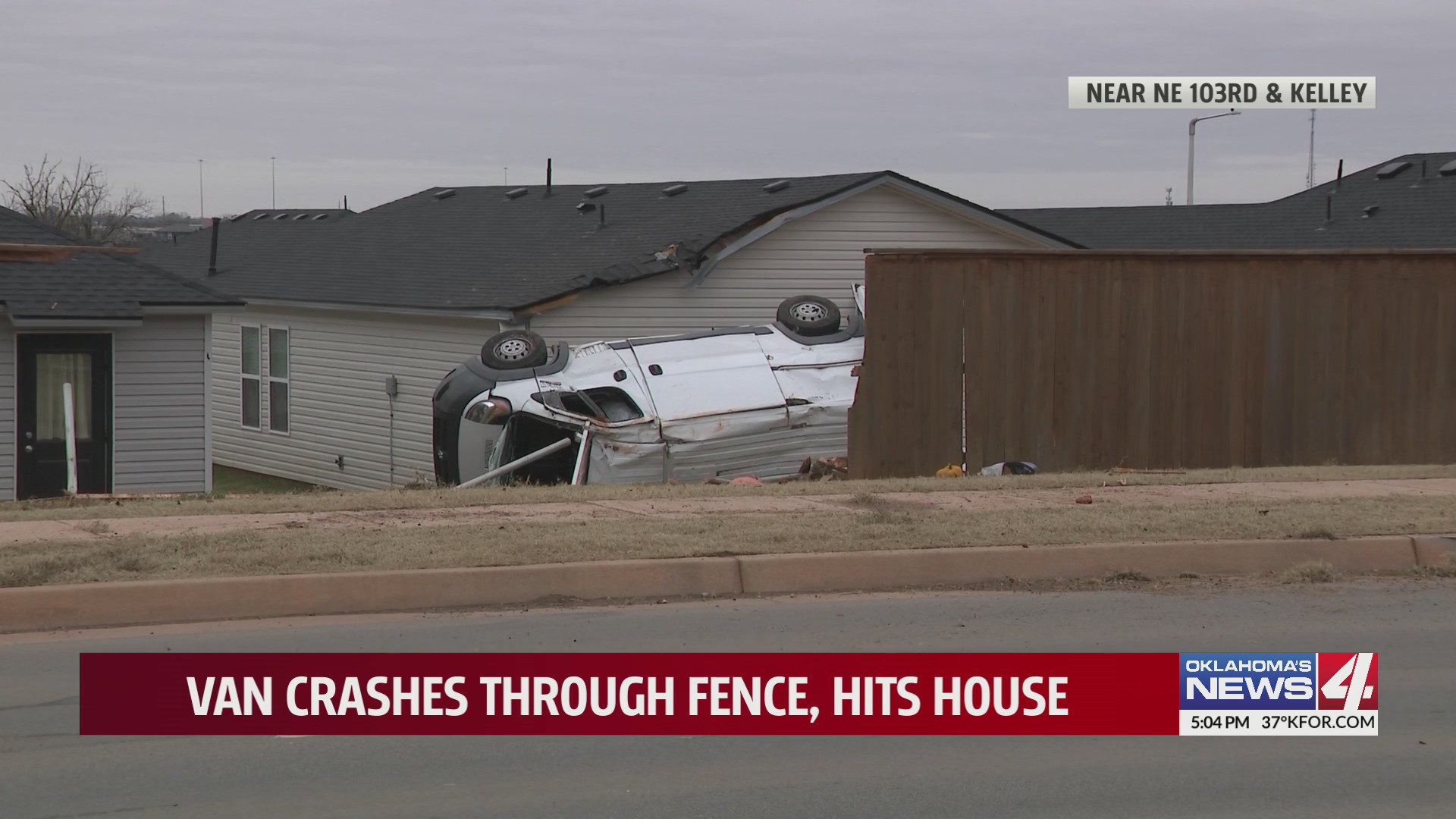 Van crashes through fence, hits house