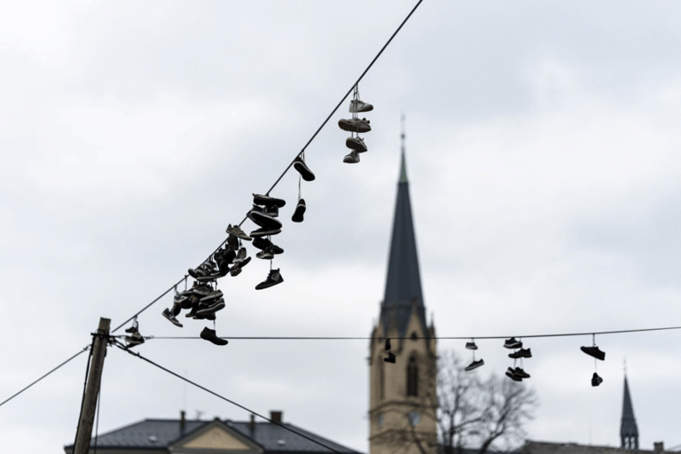 The real reasons you sometimes see shoes dangling from power lines