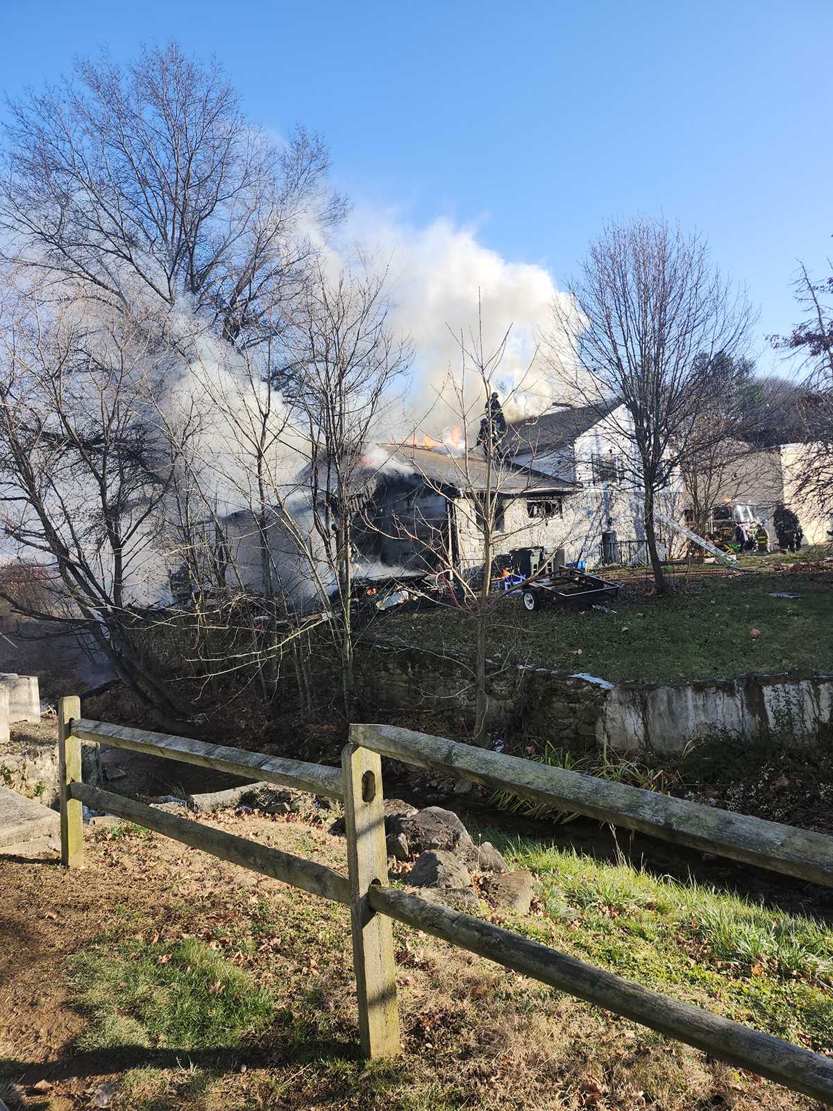 Four people escape burning home | Explosions reported