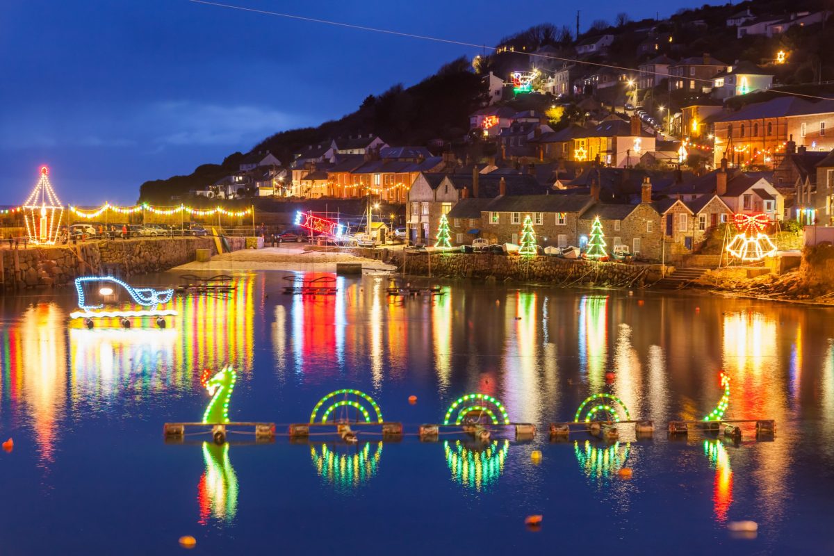 The pretty harbour town with floating Christmas lights and a cosy ...