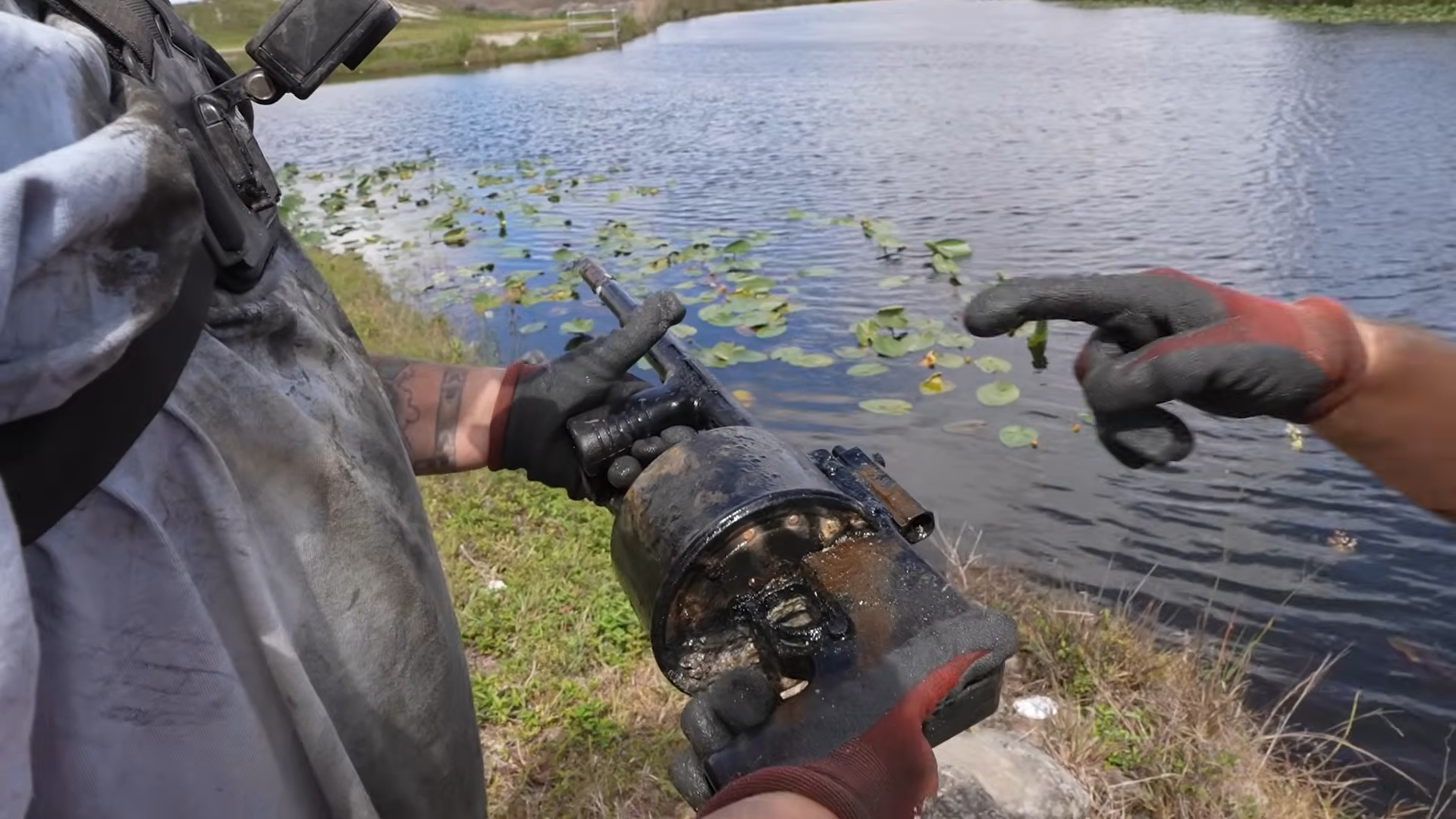 Bags of firearms, including a Tommy gun, retrieved from local river