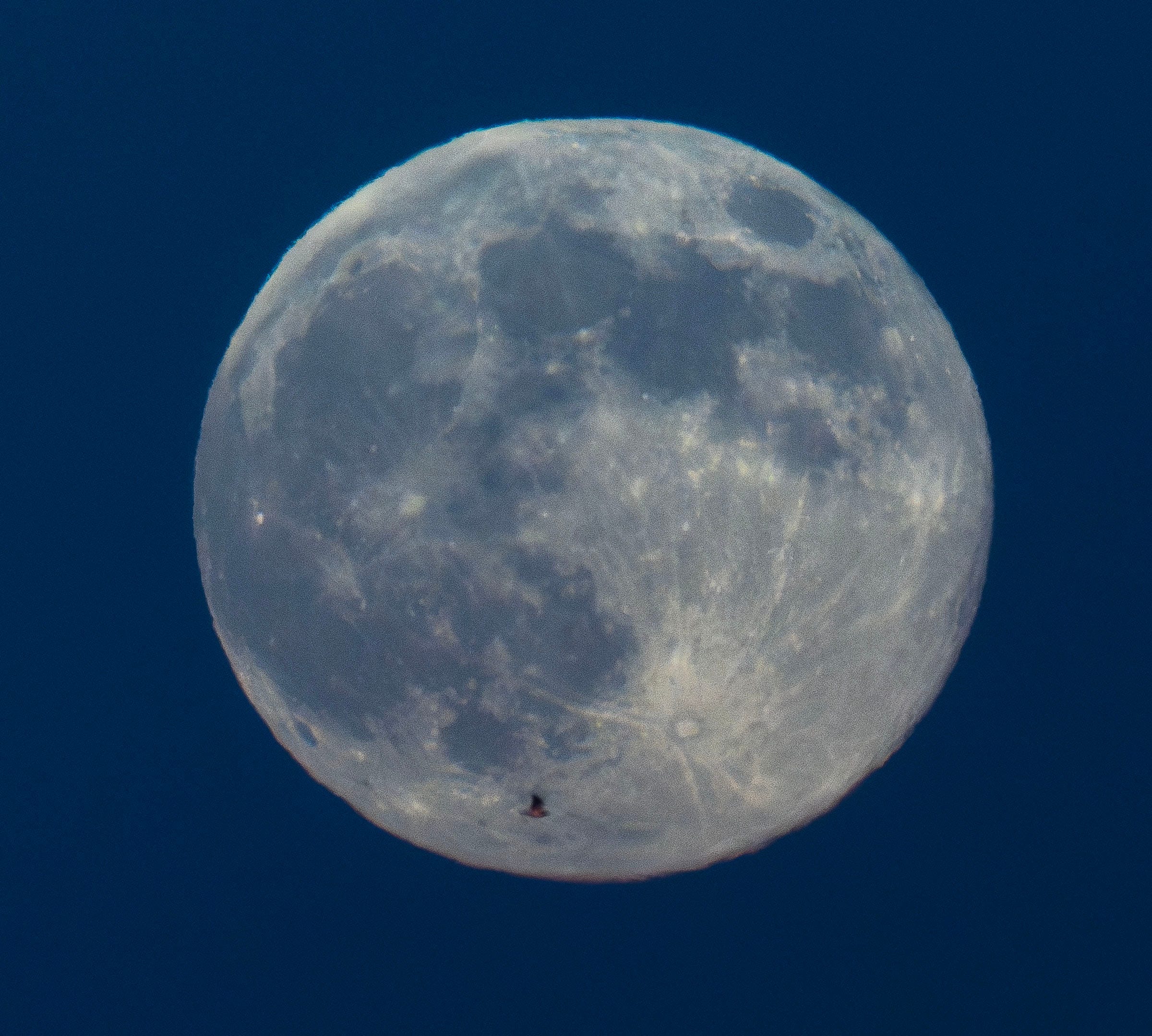 The final supermoon of 2025 lights up the night sky. See photos.