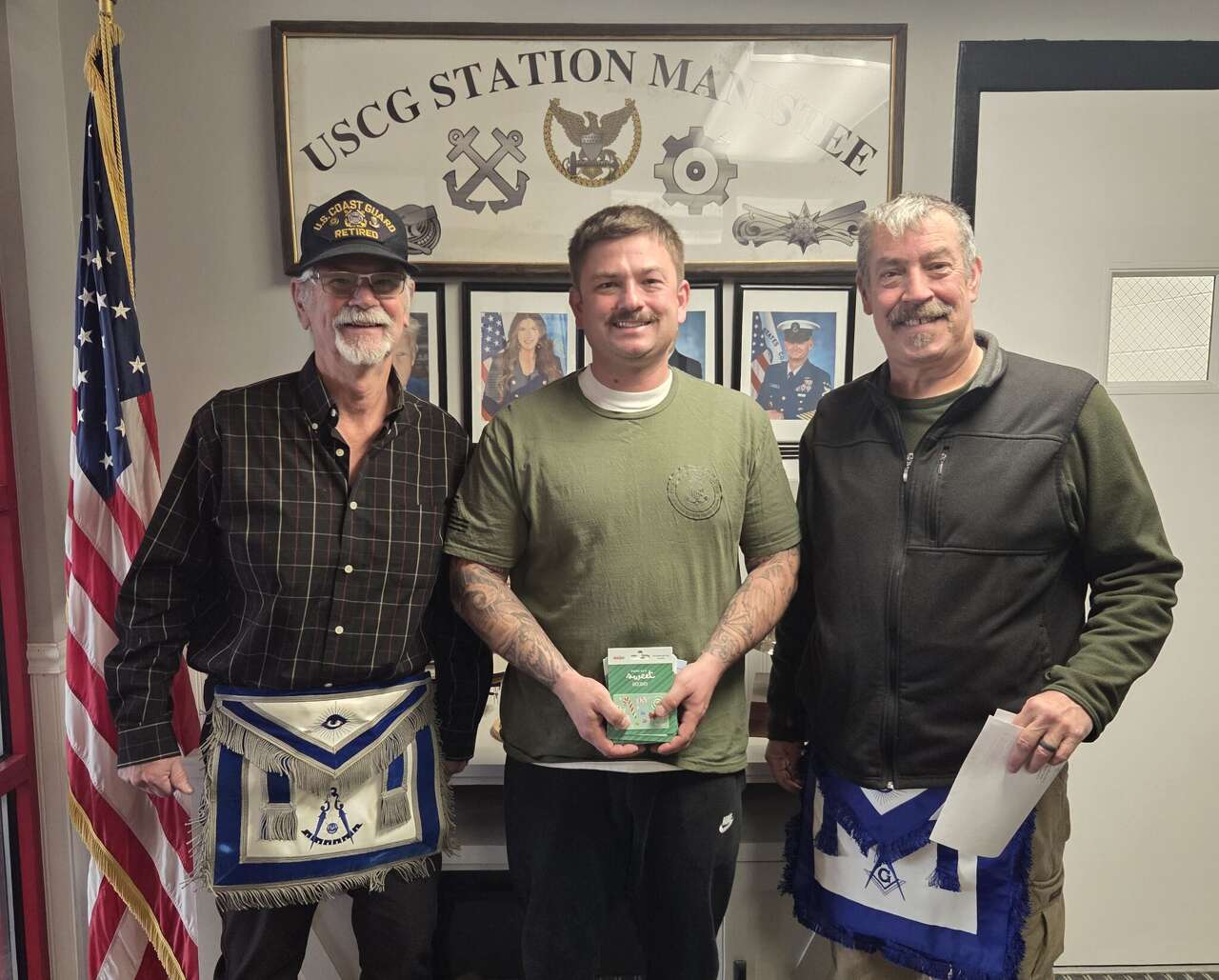 Manistee Masons donate gift certificates to Coast Guard crew