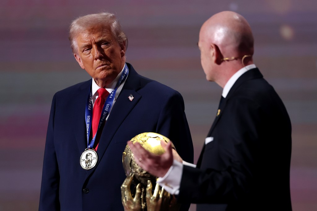 Donald Trump, as expected, awarded new FIFA peace prize at World Cup draw