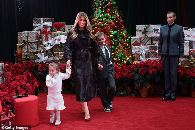 Adorable moment Melania hugs five-year-old patient at children's hospital