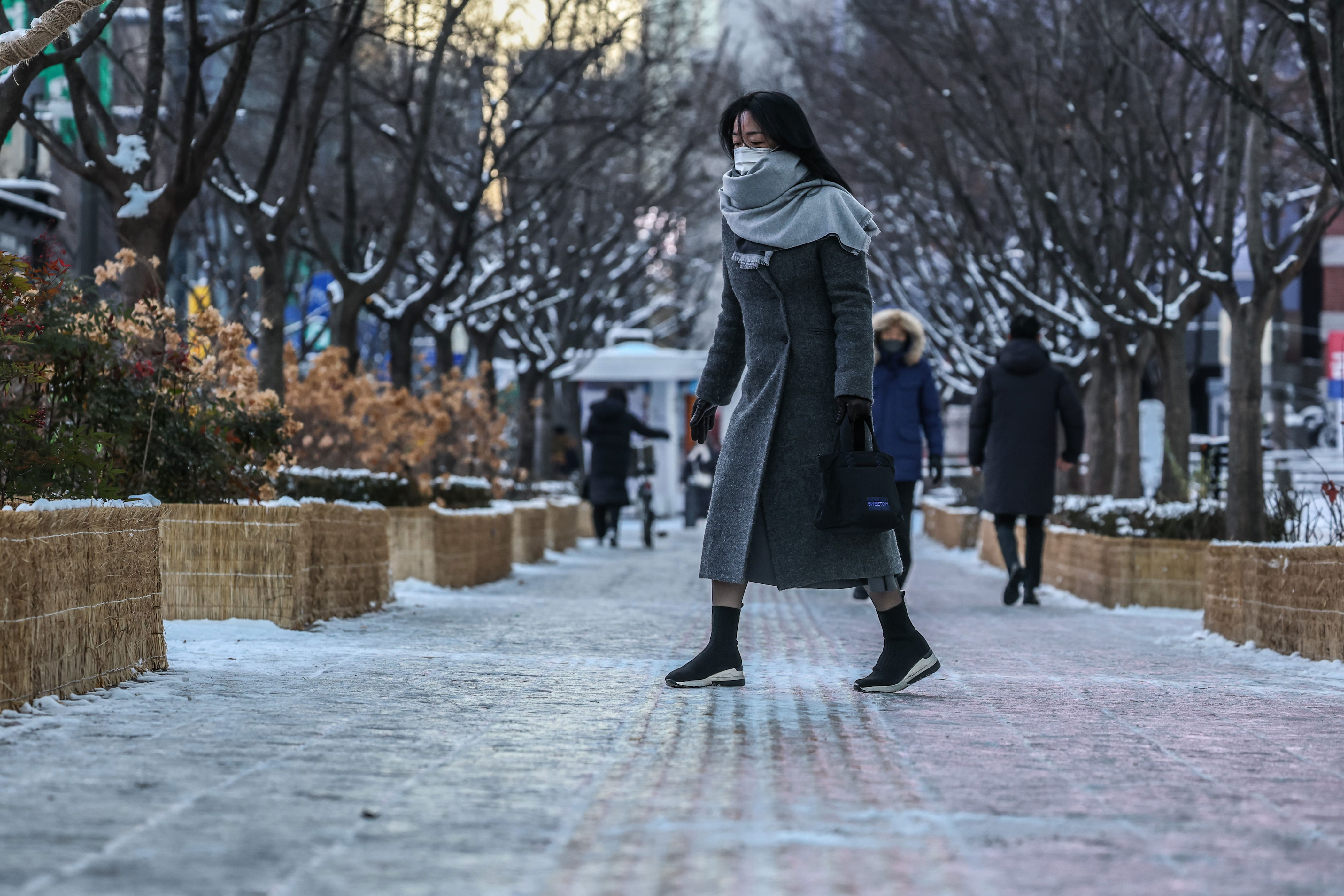 Icy roads persist as rain, snow expected nationwide