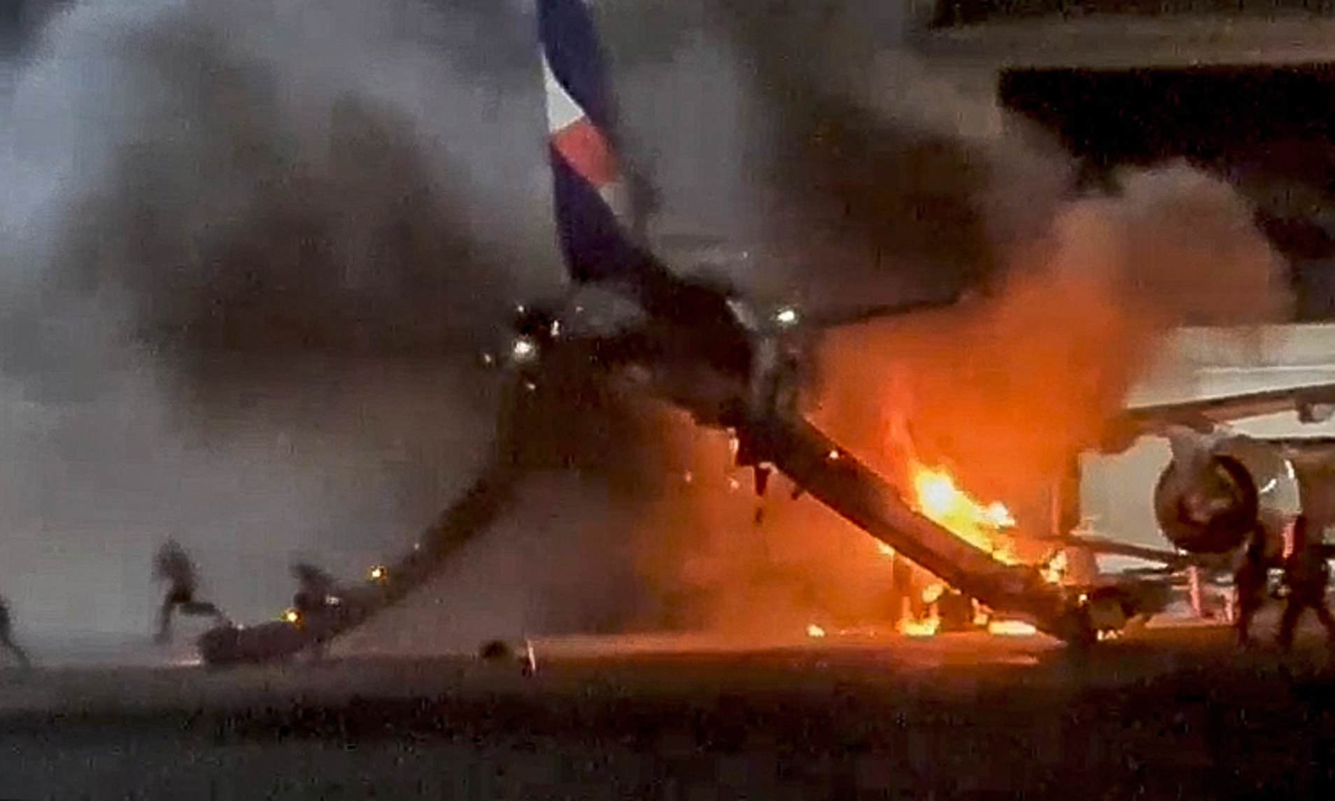 Panicked passengers told to 'leave everything' and flee plane as it is ...