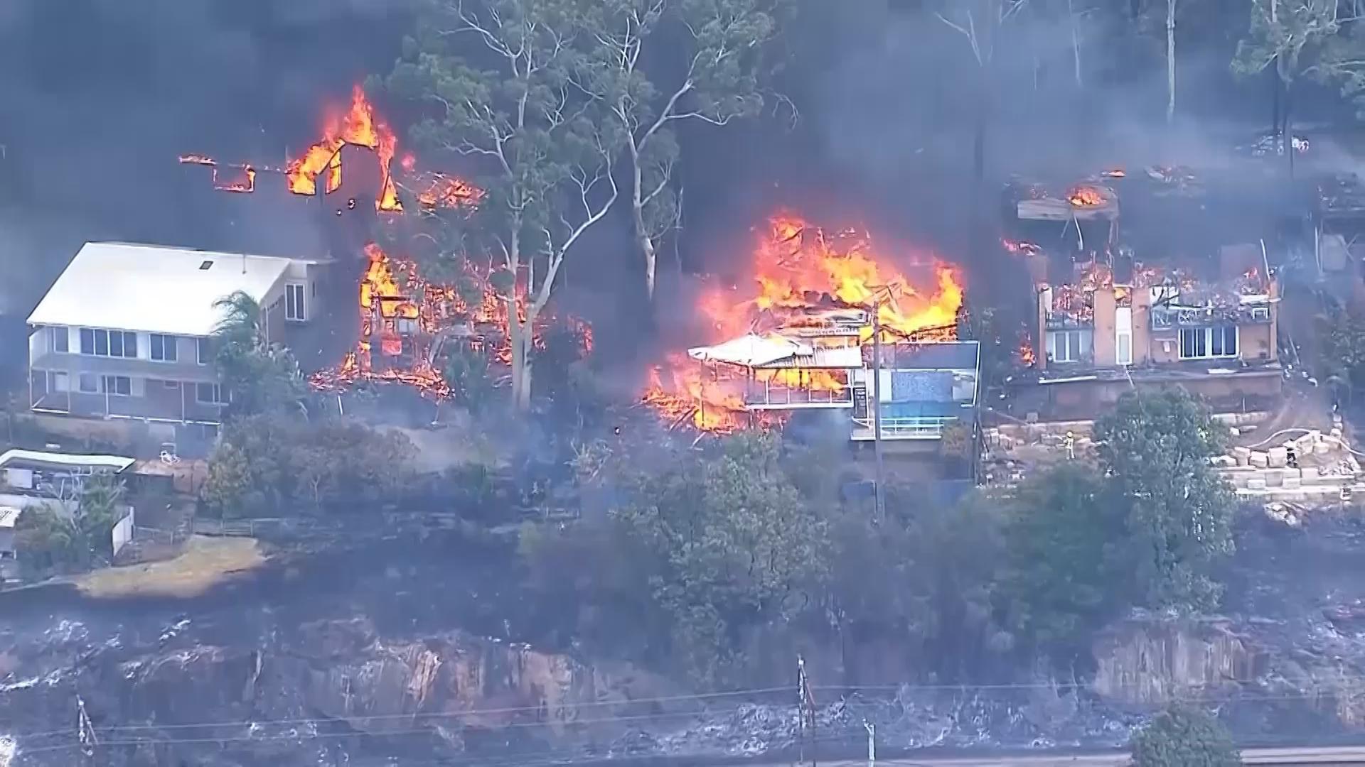 At least 12 homes damaged or destroyed in wildfire north of Sydney ...