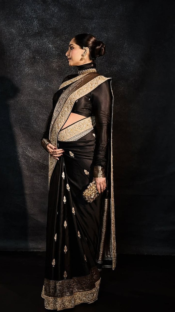 Sonam Kapoor shows off her bare baby bump in black Banarasi saree at ...