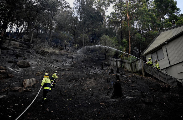 Australia downgrades wildfire alerts after activating disaster relief ...