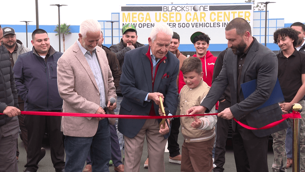 A ribbon-cutting ceremony was held for the new Mega Used Car Center
