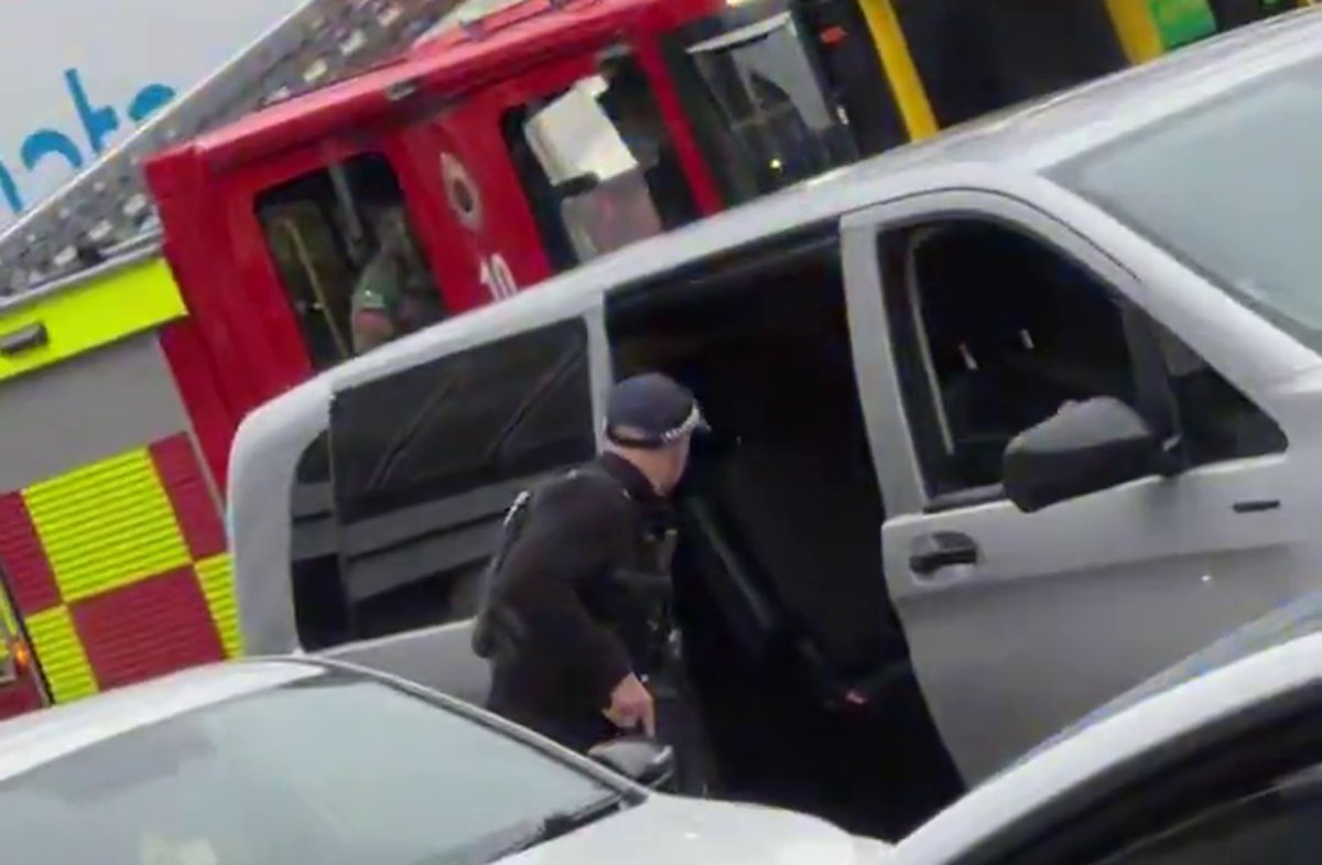 Armed police search cars at Heathrow