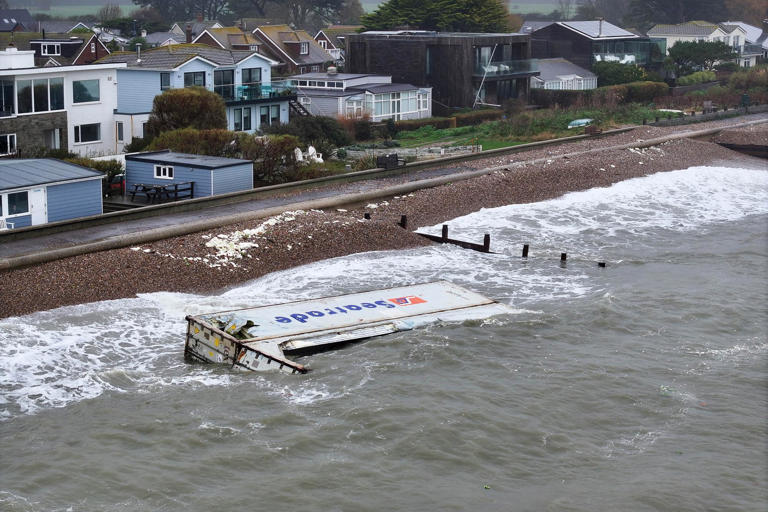 Shipping containers and bananas wash up on Selsey beach in West Sussex ...