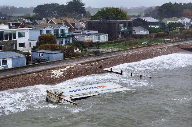 In pictures: Shipping containers wash up on Sussex shore