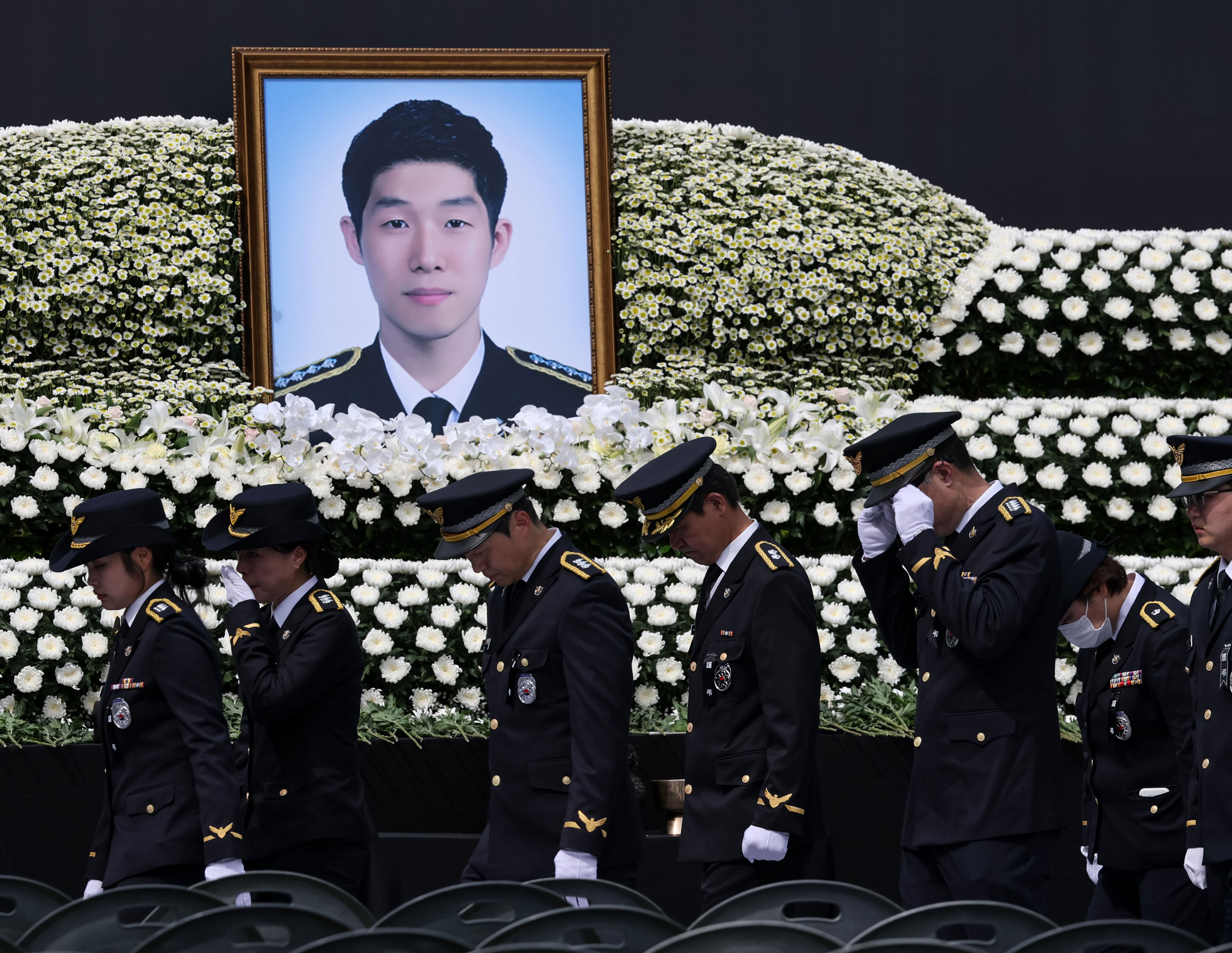 Marine police officials stand trial in officer's death case