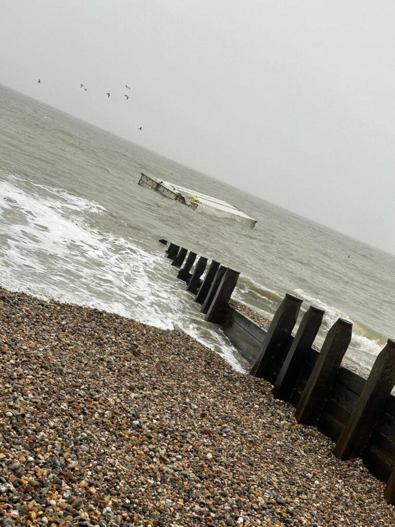 Bananas wash up on a beach as shipping containers topple overboard from ...