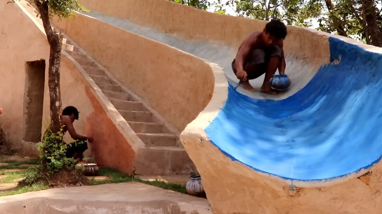 This handcrafted mud villa with a pool and waterslide looks more ...