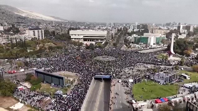 Drone footage shows gathering in Damascus to mark first anniversary of ...