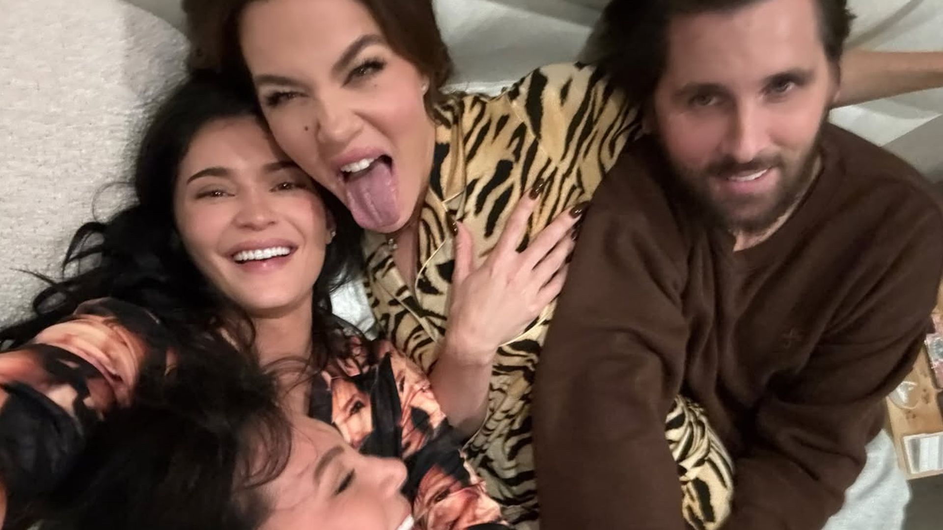 Khloe Kardashian and Scott Disick cuddle in bed for a family sleepover