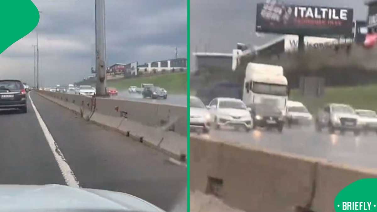 A Midrand highway video showed rain falling on one side of the road ...
