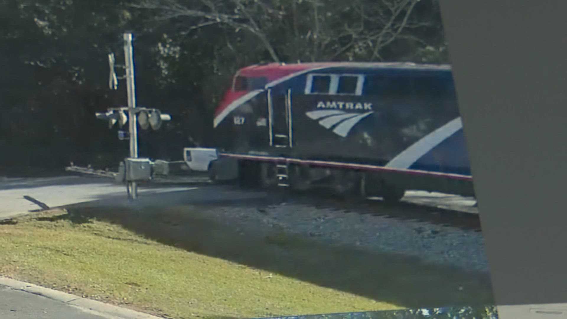 Video shows Amtrak smashing off back half of truck that drove through ...