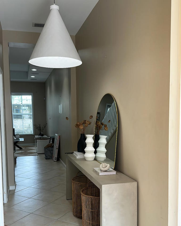 A beige entryway is completely unrecognizable after this gorgeous one ...