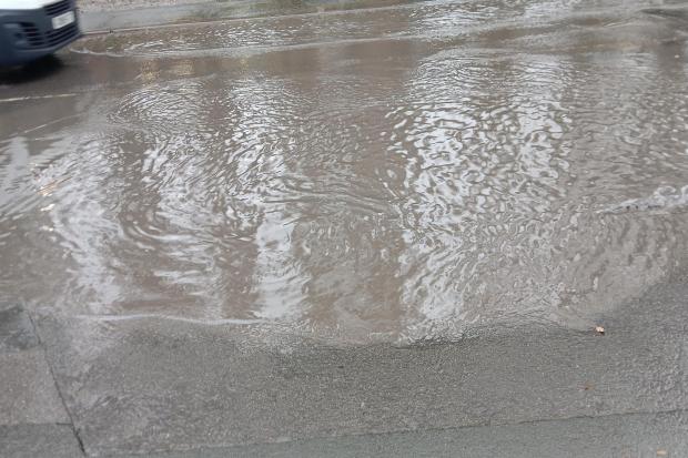 Deep puddle blocks busy road in Swindon as Storm Bram hits