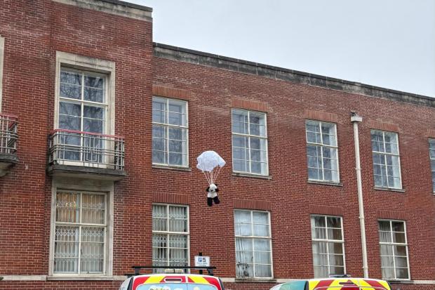 Teddy bears parachute from top of Civic Offices
