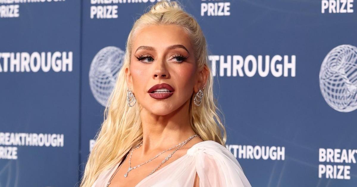 Christina Aguilera's Bodysuit & Sheer Tights Are So Holiday-Coded