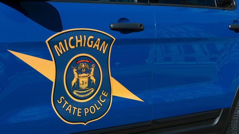 Flint man accused of dragging Michigan State Police trooper with car